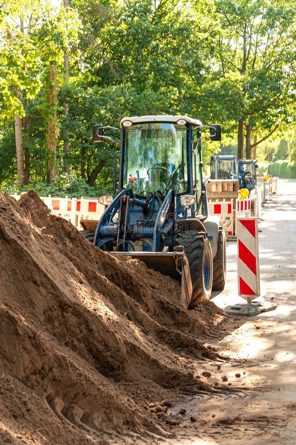 Vertical Shot of the Tractor on a Construction Land Stock Photo - Image ...