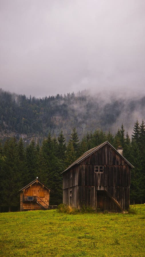 Vertical Shot of Traditional Rural House with the Backdrop of Towering ...