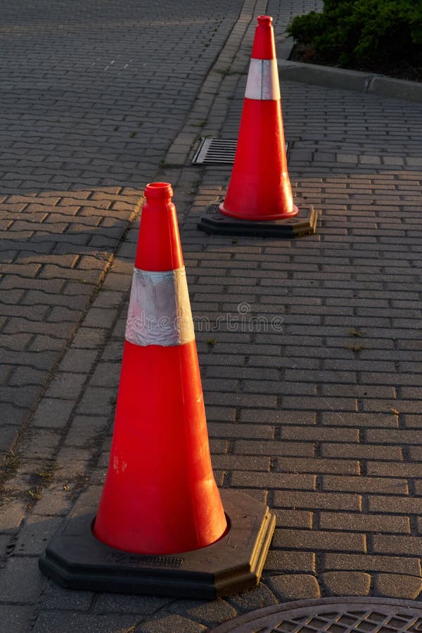 Vertical Shot of Traffic Cones Placed Outdoors Stock Photo - Image of ...