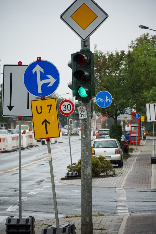 Vertical Shot of Traffic Lights and Road Signs Stock Photo - Image of ...
