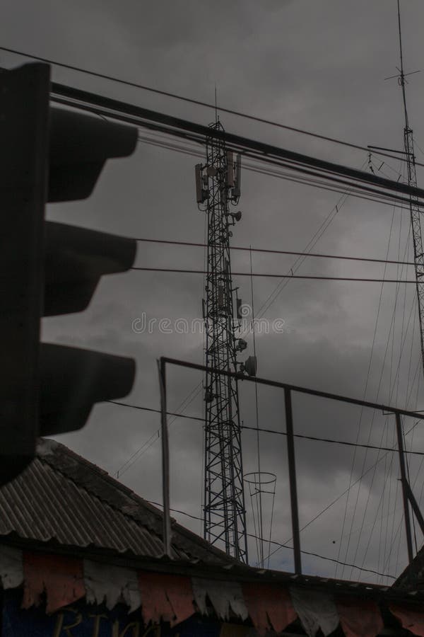 Vertical Shot of the Traffic Lights, a Tower, and a Roof Under the ...