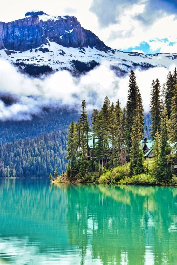 Vertical Shot of a Tranquil Scenery in the Mountains with a Lake Stock ...