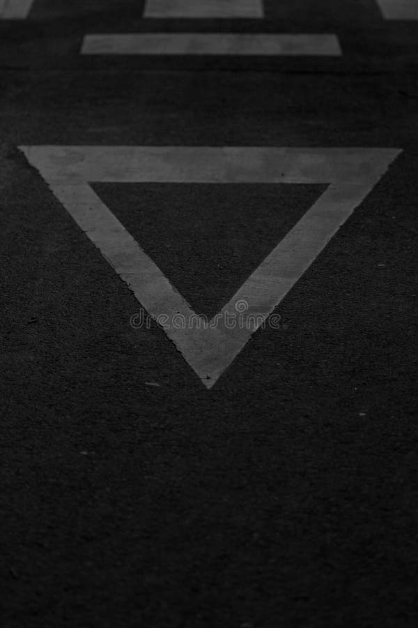 Vertical Shot of a Triangle Shaped Road Sign on the Asphalt Stock Image ...