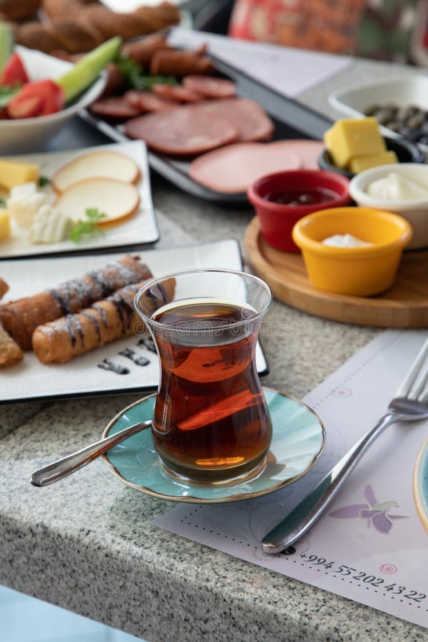Vertical Shot of a Turkish Chai Glass with Tea on a Table with ...