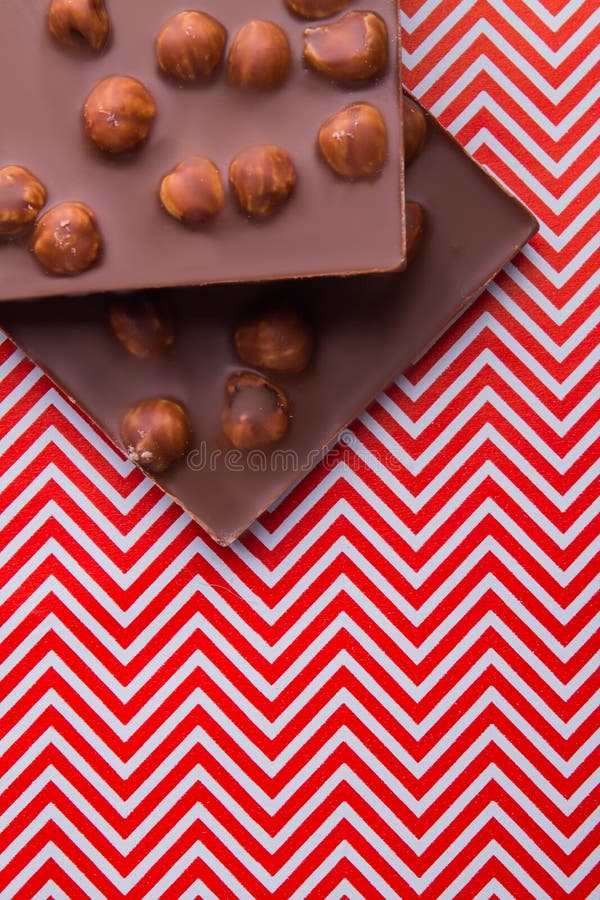 Vertical Shot Two Chocolate Bar Pieces with Hazelnuts. Stock Image ...