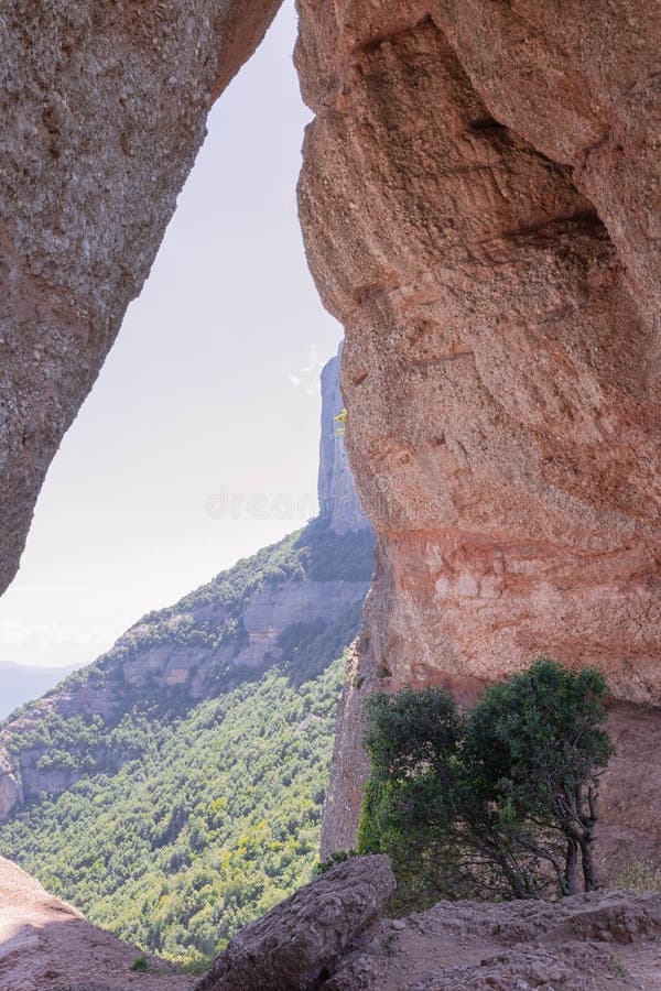 Vertical Shot of Two High Cliffs with Forest in the Background Stock ...