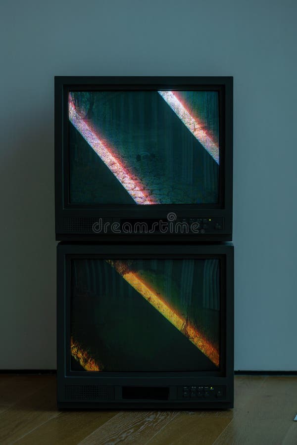 Vertical Shot of Two Piled Box Type Television on the Floor Stock Photo ...
