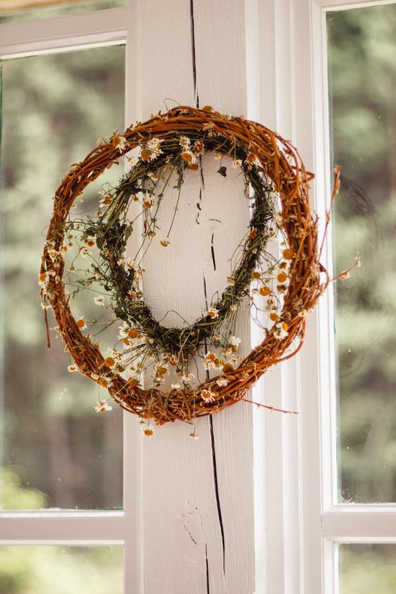 Vertical Shot of Two Wreaths Hung on a Window Frame Stock Image - Image ...