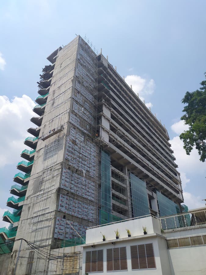 Vertical Shot of an Unfinished Multi-story Building Stock Image - Image ...