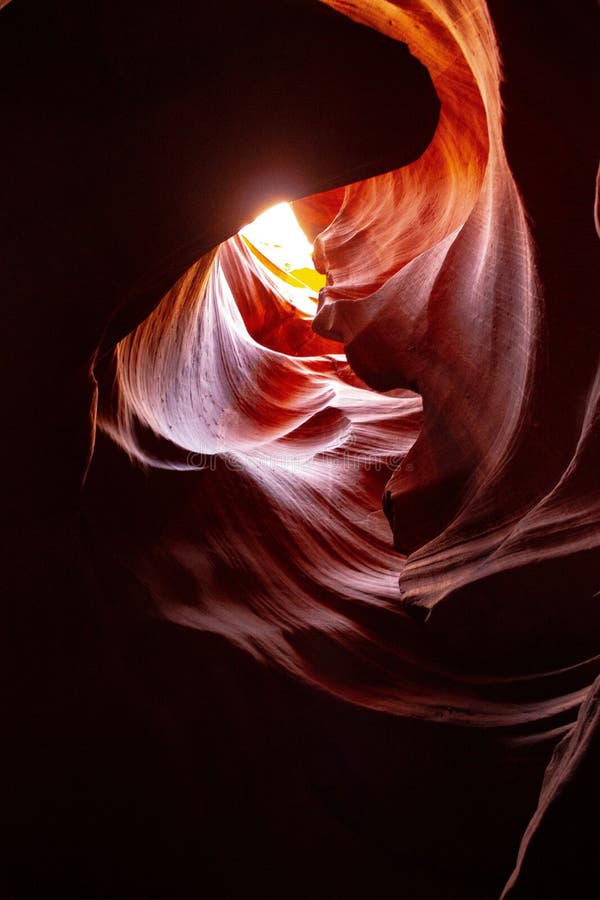 Vertical Shot of the Upper Antelope Canyon with Sunlight Barely Visible ...