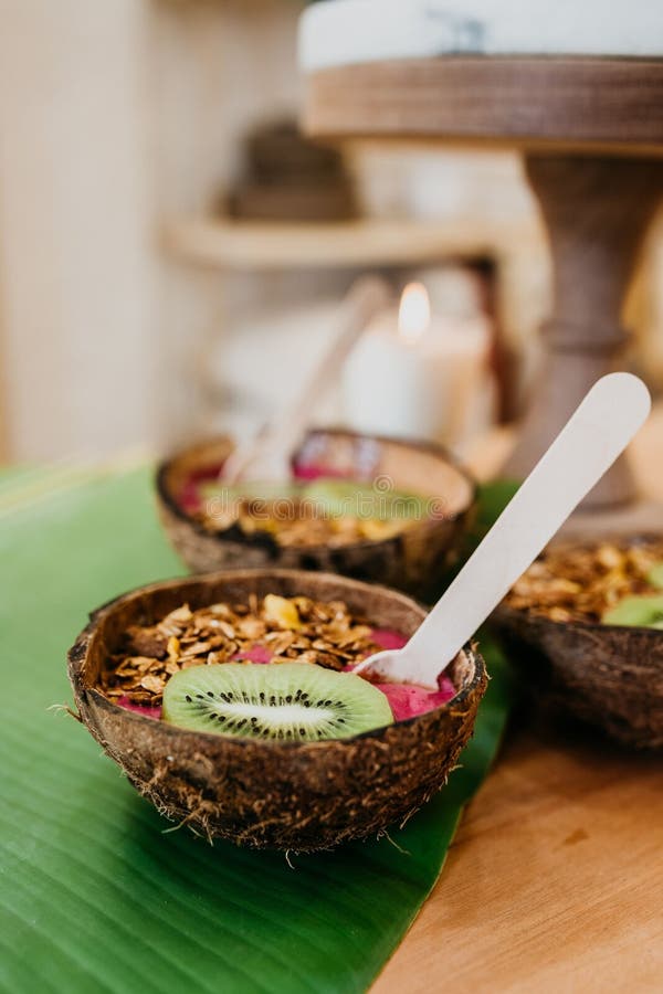 Vertical Shot of Various Desserts, Served in Coconut Shells Stock Photo ...