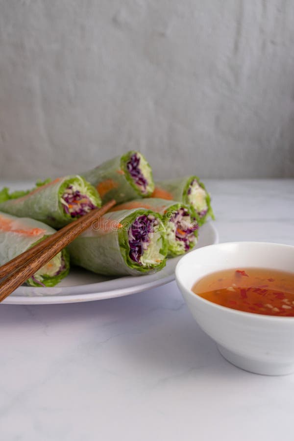 Vertical Shot of Vietnamese Spring Rolls with Fish Sauce Dip on a White ...