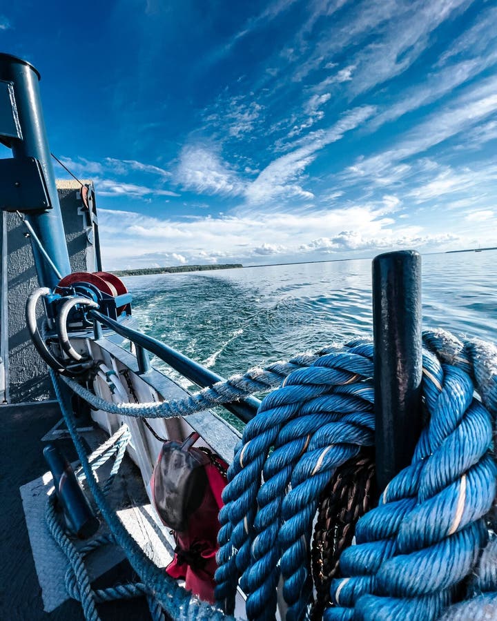 Vertical Shot of a View of Blue Water from the Side of a Ship with ...