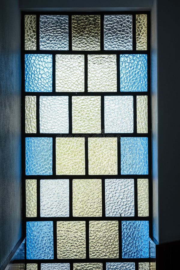 Vertical Shot of a Vitrage Window in Blue and Yellow Colors Stock Photo ...