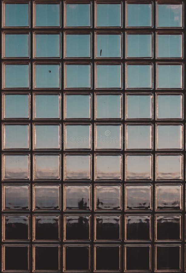 Vertical Shot of a Wall with Mirror Cubes with the Reflection of the ...