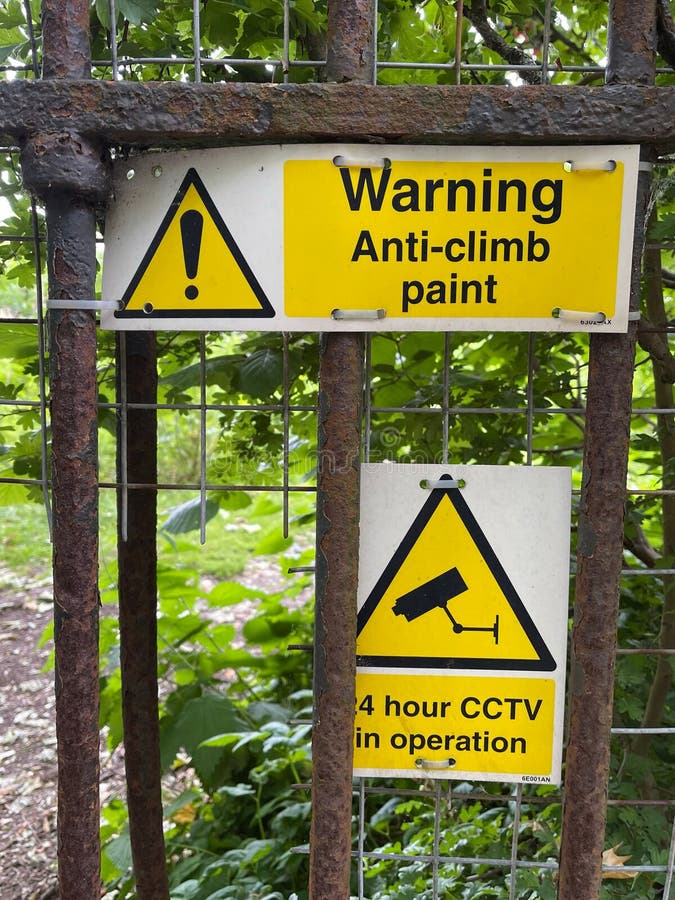 Vertical Shot of a Warning Sign CCTV on the Gate Stock Photo - Image of ...