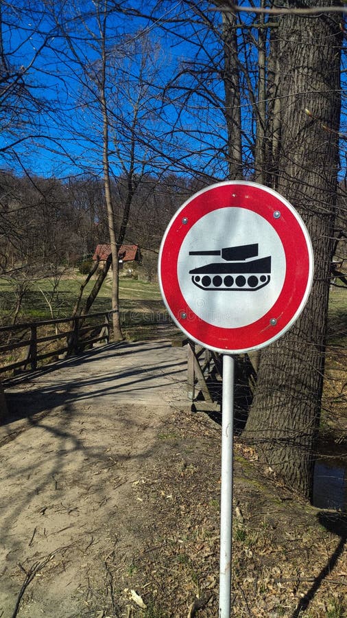 Vertical Shot of a Warning Sign with a Tank Stock Image - Image of ...