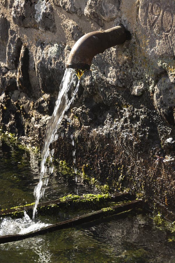 Vertical Shot of Water Pouring from a Rusty Pipe Stock Photo - Image of ...
