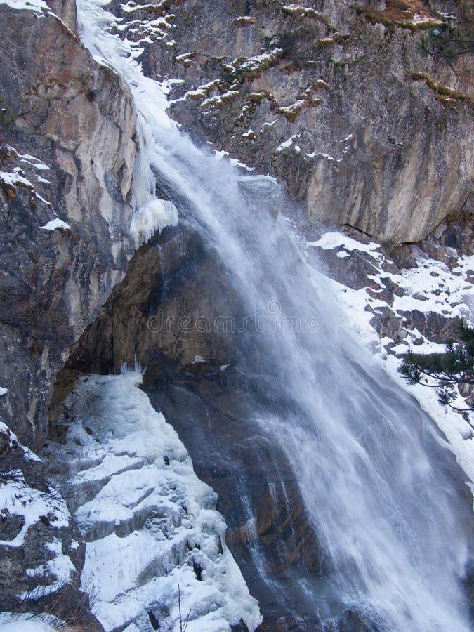 Vertical Shot of a Waterfall in Alps Stock Photo - Image of forest ...
