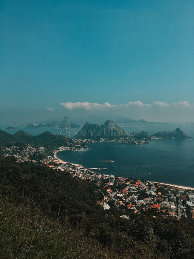 Vertical Shot of a Waterfront Small Town Cityscape Under a Beautiful ...