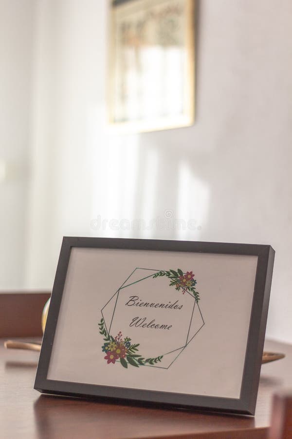 Vertical Shot of a Welcome Card in a Frame on a Table Stock Image ...
