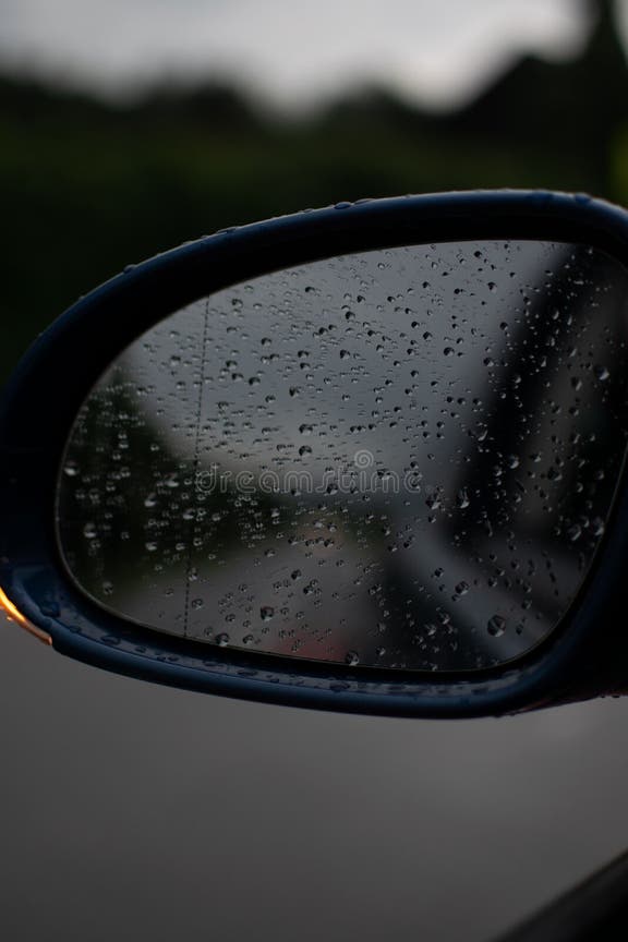 Vertical Shot of a Wet Side Mirror of a Car. Stock Photo - Image of ...