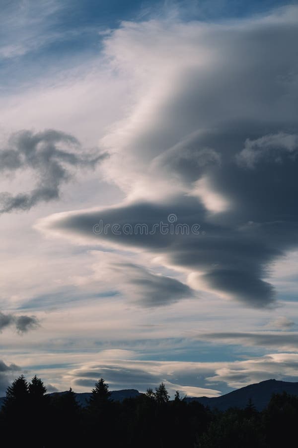 Vertical Shot of White Clouds Forming a Human S Face with a Big Nose ...