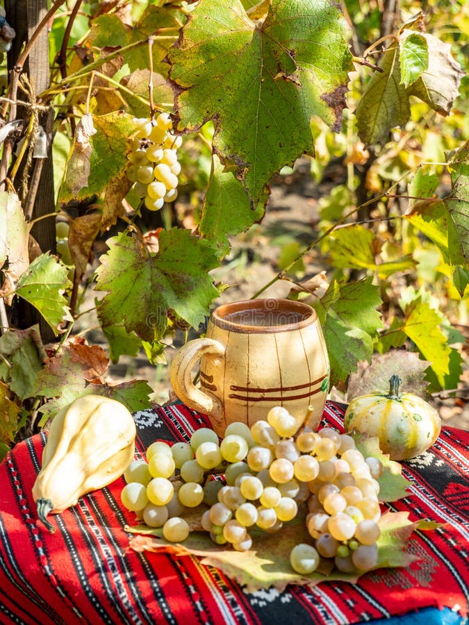 Vertical Shot of White Grapes on a Small Table Outdoors. Stock Image ...
