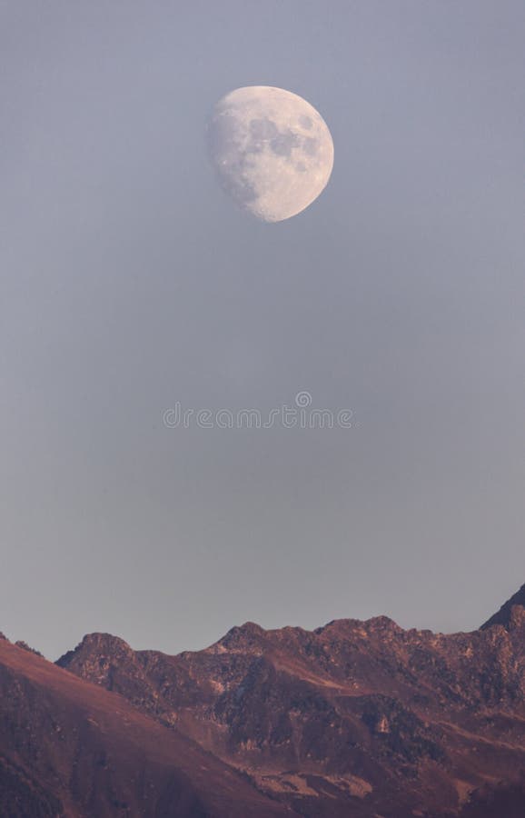 Vertical Shot of a White Half-moon Over Cliffs Stock Photo - Image of ...