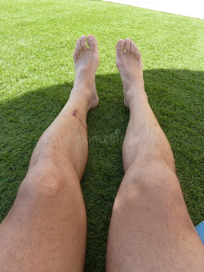 Vertical Shot of White Male Feet on a Lawn Stock Photo - Image of hand ...