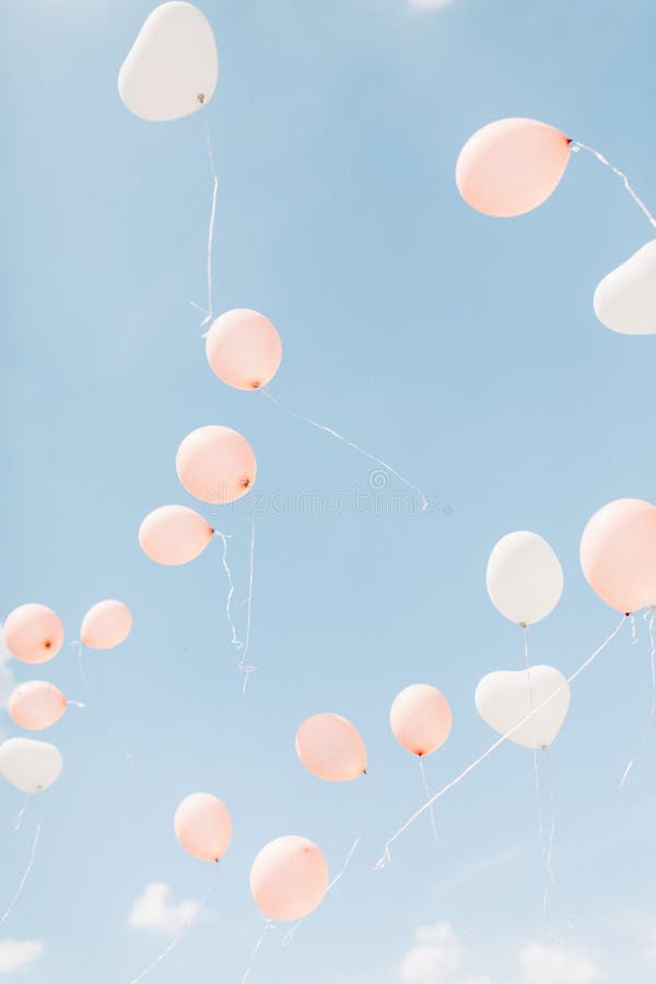 Vertical Shot of White and Pink Balloons in the Clear Sky Stock Image ...