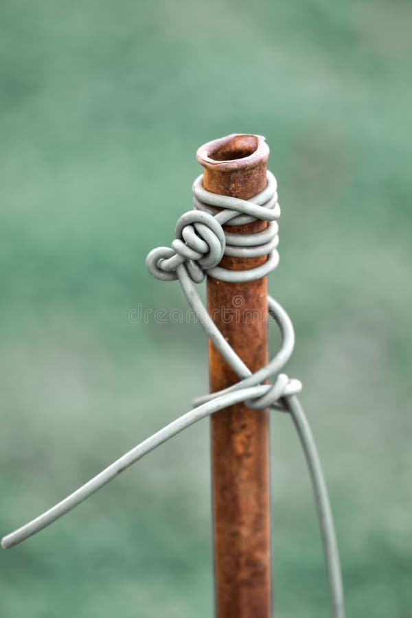 Vertical Shot of a White Wire Around in a Stick Stock Image - Image of ...