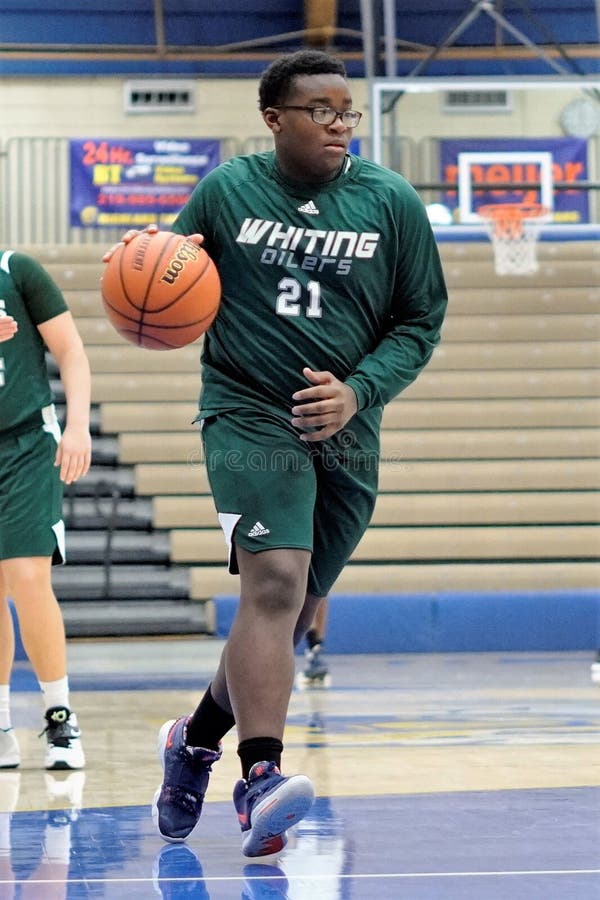Vertical Shot of a Whiting Basketball Player Playing at a Competition ...