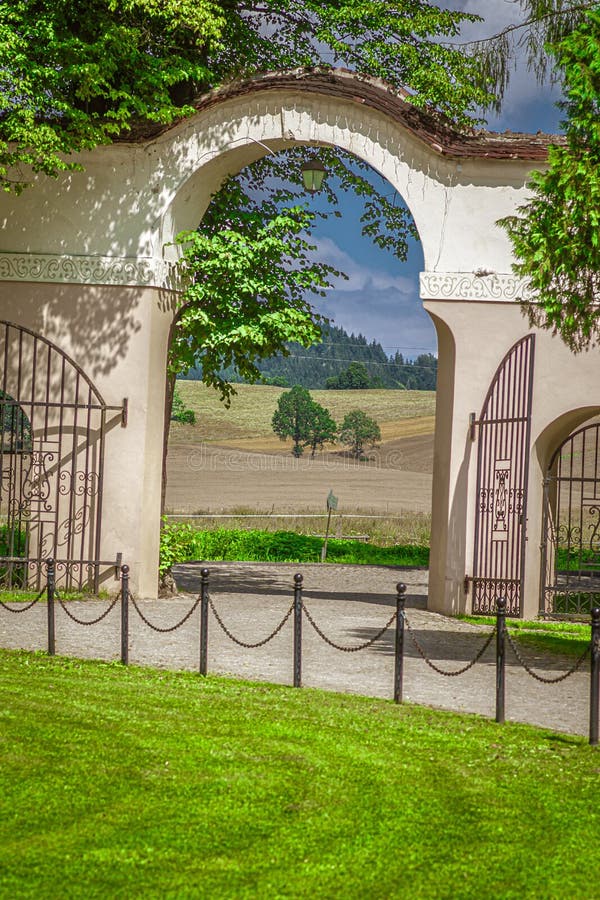Vertical Shot of a Wide Open Gate of a Park Stock Image - Image of open ...