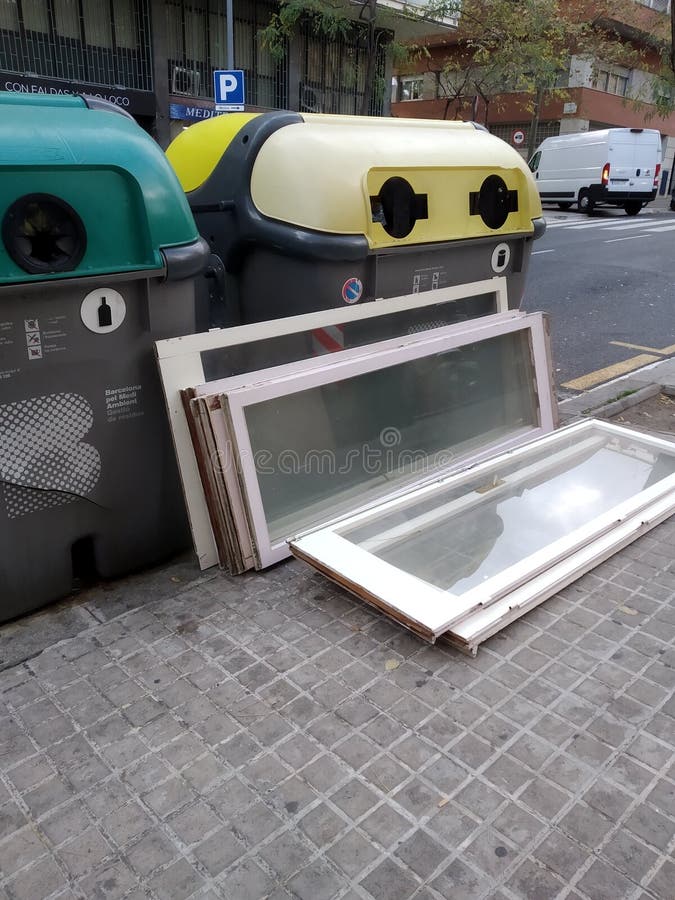 Vertical Shot of Windows Near Trash Cans for Separate Waste Collection ...