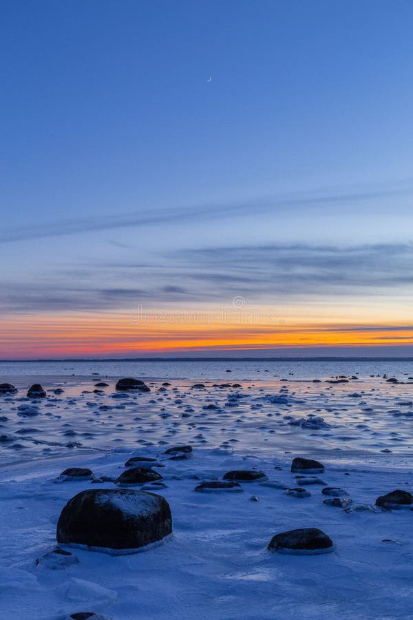Vertical Shot of a Winter Sunset at a Snowy Beach Stock Image - Image ...