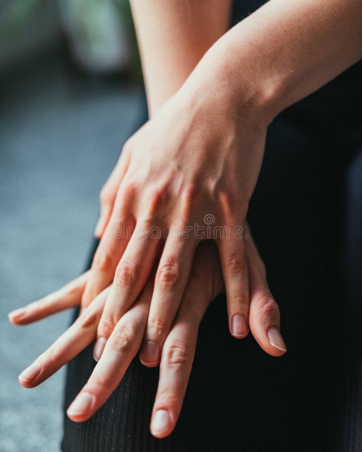 Vertical Shot of a Woman& X27;s Hand on Her Lap Stock Image - Image of ...
