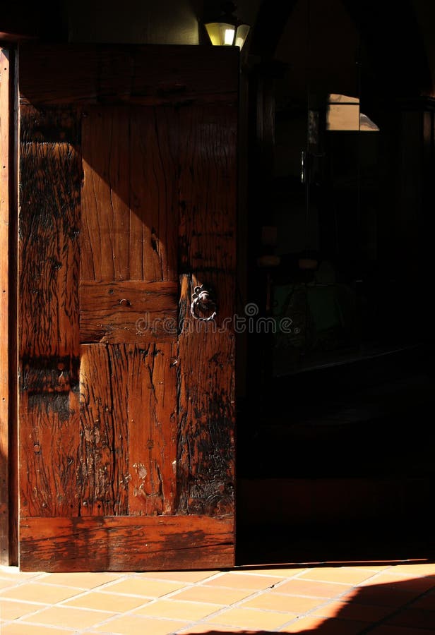 Vertical Shot of a Wooden Door Covered in a Shadow Stock Photo - Image ...