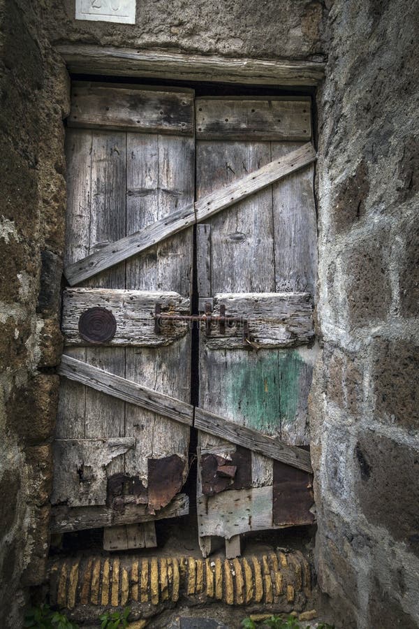 Vertical Shot of a Wooden Door with a Rusted Lock Stock Image - Image ...