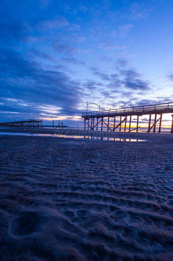 Vertical Shot of a Wooden Port Over the Shore at Sunset Stock Photo ...