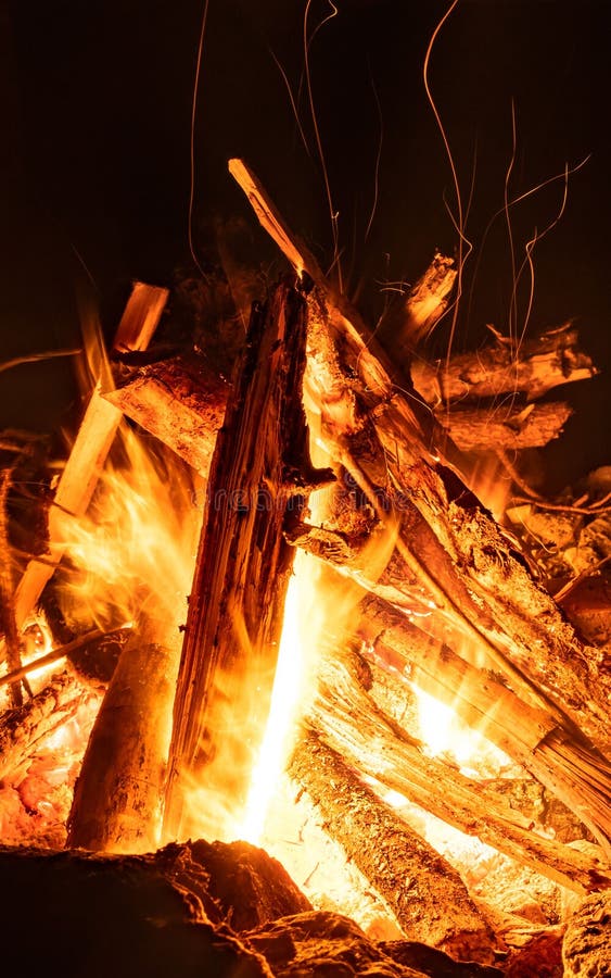 Vertical Shot of Woods Burning in a Campfire at Night Stock Image ...
