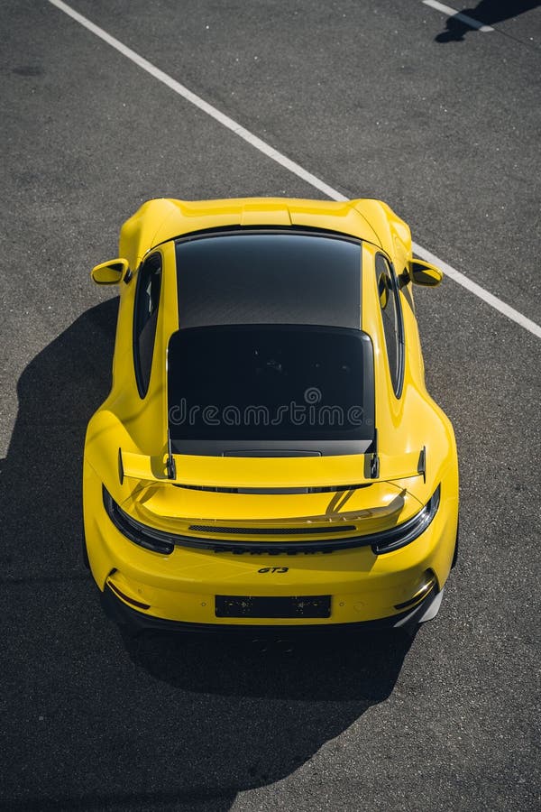 Vertical Shot of a Yellow Porsche Parked Outdoors Editorial Photography ...