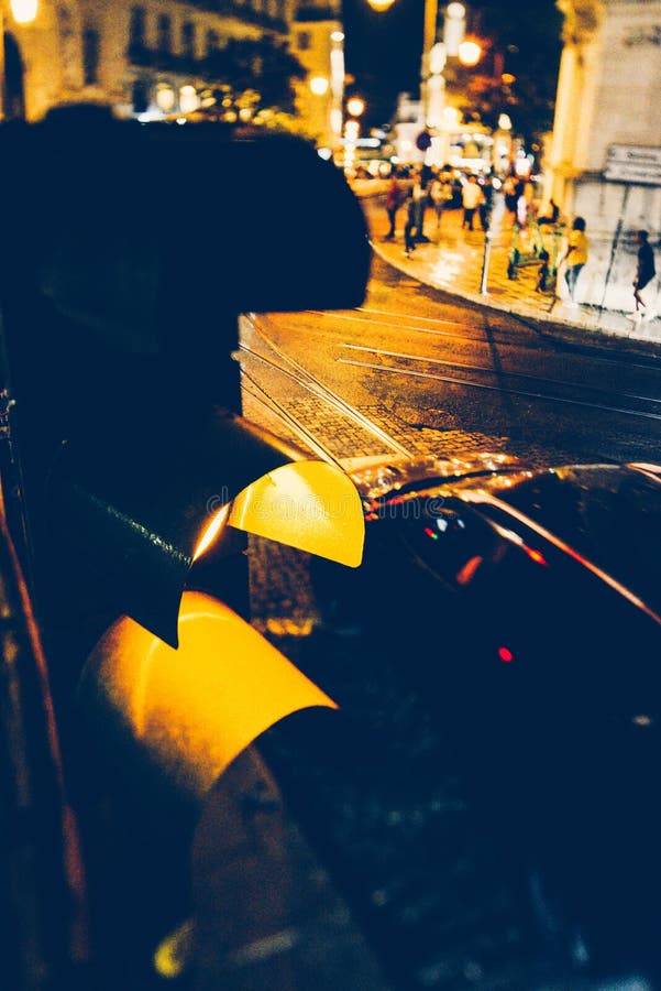 Vertical Shot of a Yellow Traffic Light at Night Stock Photo - Image of ...