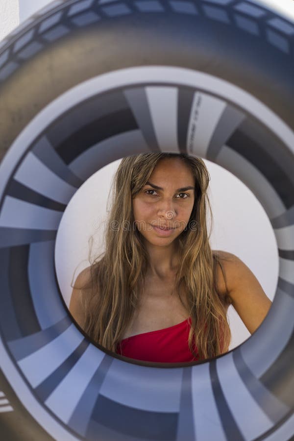 Vertical Shot of a Young Attractive Hispanic Female Smiling through a ...