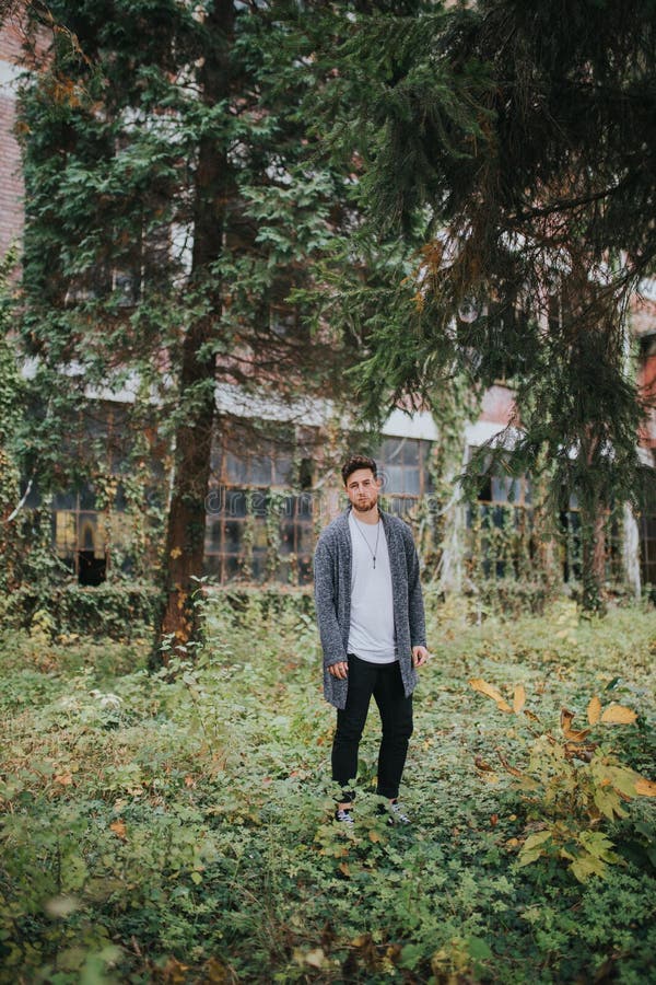 Vertical Shot of a Young and Attractive Male Posing at Camera Stock ...