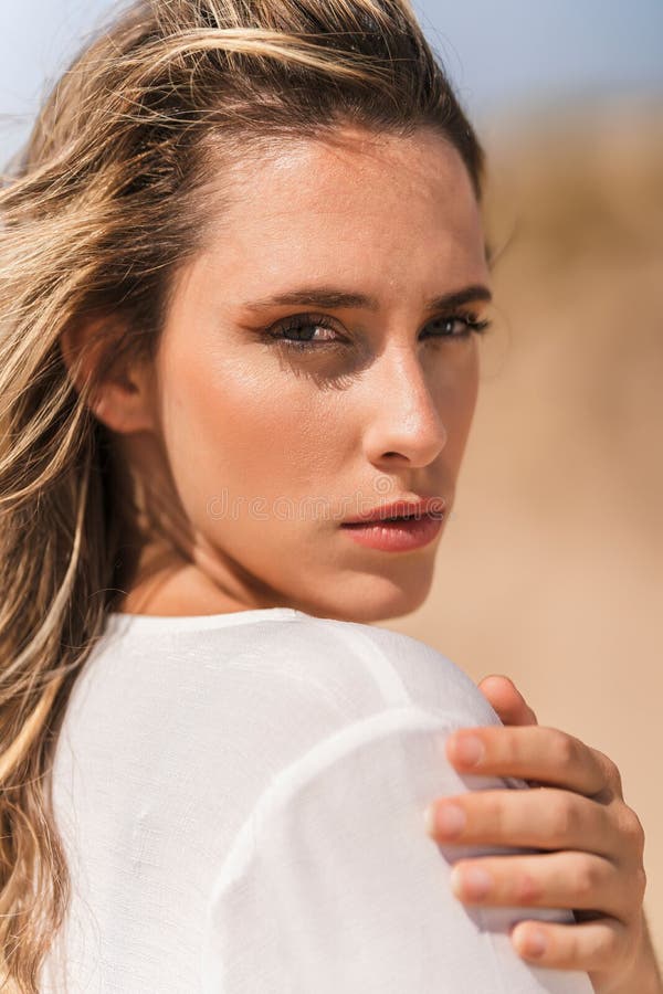Vertical Shot Of A Young And Beautiful Spanish Woman In A Bikini And