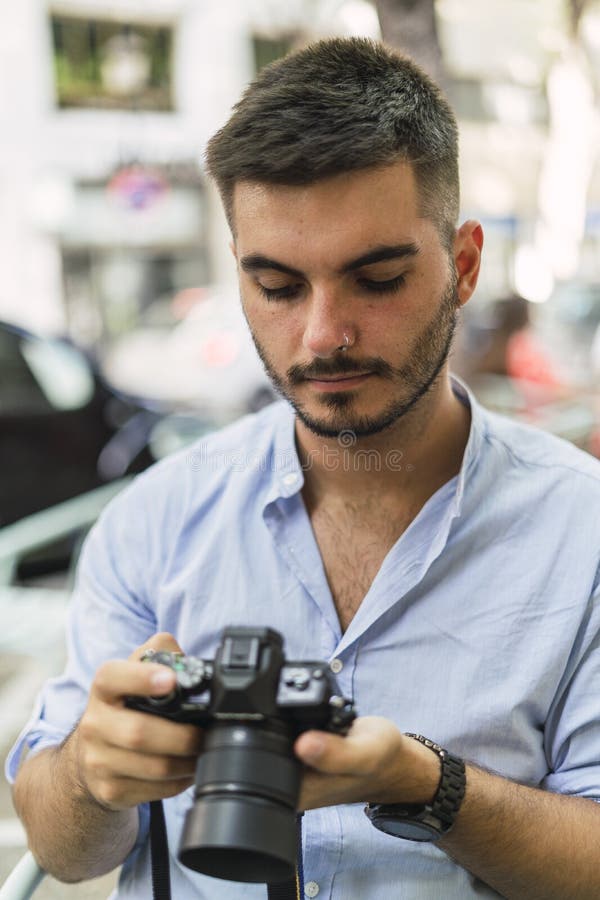 Vertical Shot of a Young Caucasian Male Looking at His Camera Stock ...