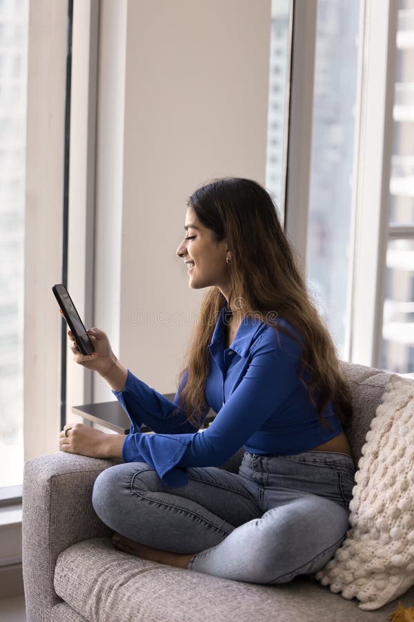 Woman Settled Down Comfortable on Couch Using Modern Smartphone Stock ...