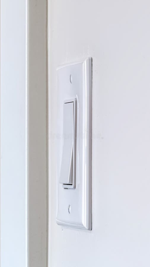 Vertical Side View of Electrical Rocker Light Switch Mounted on White ...