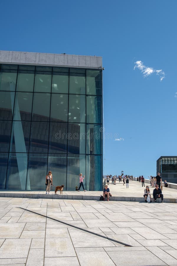 Vertical Side View of the Oslo Opera Building and People Resting Around ...
